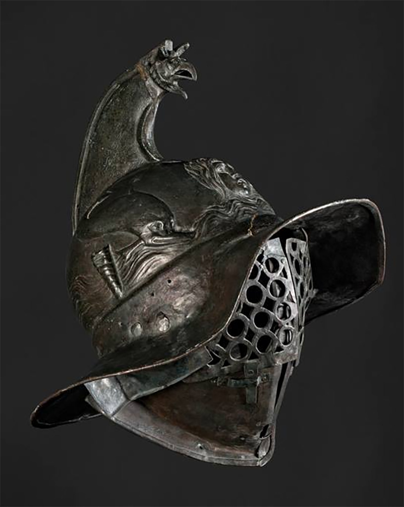 VIII.7.16 Pompeii. Thraex gladiators helmet. The crest of this helmet ends in a griffin’s head ...